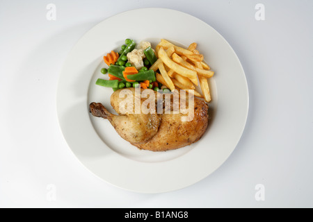 Mixed main course with half roast chicken French fries and vegetables ...