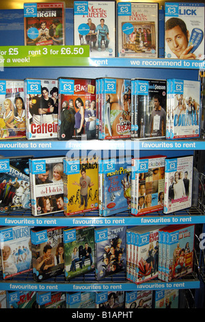 Shelf of DVD movies for rental inside a blockbuster store Stock Photo ...