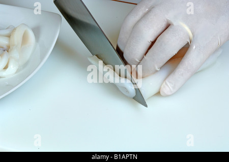 Cutting squid into rings Stock Photo - Alamy