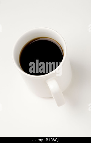 White coffee in a mug on dark wooden background Stock Photo - Alamy