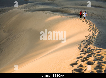 People walking in the sand dunes by Rubjerg Knude Lighthouse (Rubjerg ...