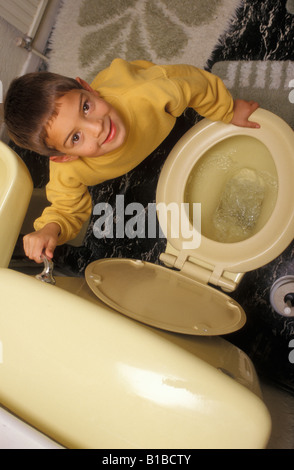 young child, boy, learning to use the toilet, loo, sitting on seat, two ...
