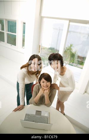 Asian women using laptop computer video call consultation talking ...