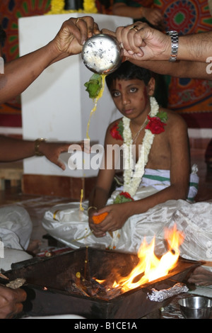 Priest and father perform havan - a sacred purifying ritual ( yajna ...