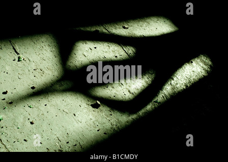 woman forming shadow figures with her body Stock Photo - Alamy