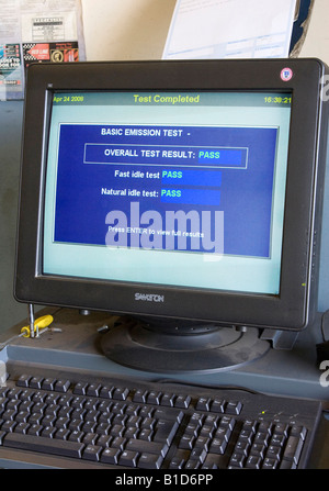 exhaust emissions test equipment being used during an MOT check for a ...