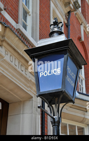 Traditional metropolitan police lamp post outside a police station ...