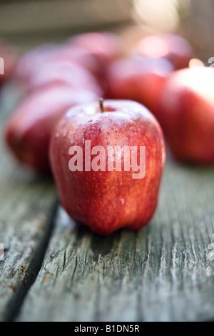 fresh shiny red apple on wooden table Stock Photo - Alamy