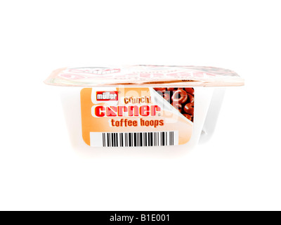 A pot of Toffee Hoops Muller Corner crunch yogurt on a white background ...