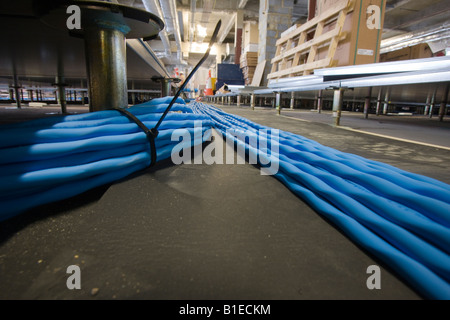 Data cabling is routed under a raised floor in a newly constructed ...