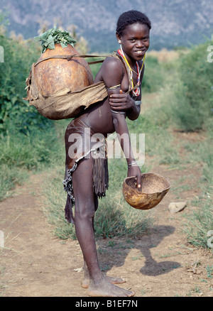 A Tsemay girl of southwest Ethiopia wears a leather skirt and bright ...