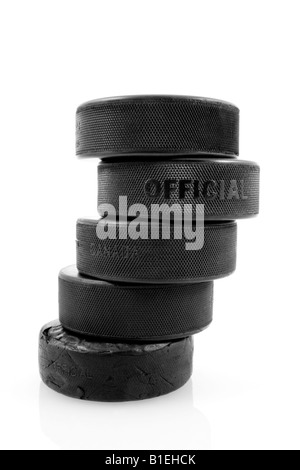 Pile of Black Ice Hockey Pucks on ice Stock Photo - Alamy