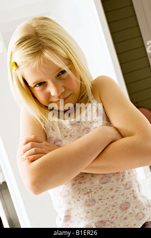 blond tween girl making a face expression of surprise Stock Photo - Alamy