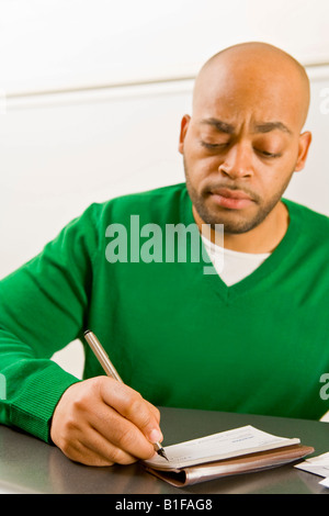 Writing A Check Stock Photo - Alamy