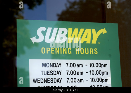 Subway food outlet opening hours sign, UK Stock Photo - Alamy