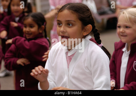 Indian school girls traditional hair style with plaits, bows and a ...