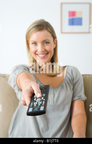 Caucasian woman pointing to eye watching you gesture, suspicious ...