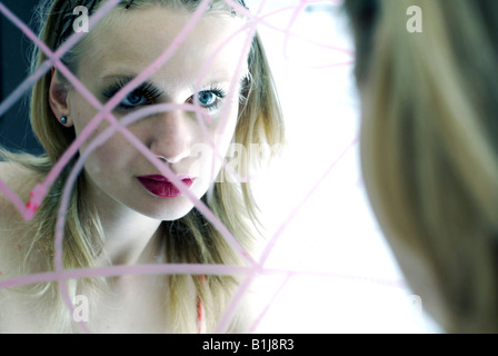 mirror image of a young, heavily rouged woman Stock Photo - Alamy