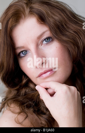 Beautiful brunette curly hair young girl wearing glasses over isolated ...