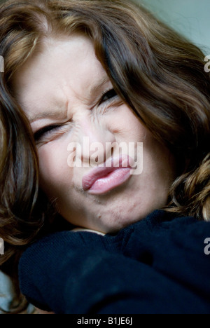 Portrait young woman, gurning Stock Photo - Alamy