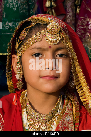 A Rajasthani girl dressed in her finest clothing and jewelry to ...