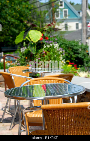 Flowers tables and chairs of an outdoor cafe in europe Stock Photo - Alamy