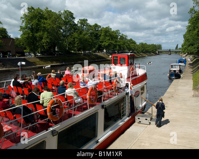 York river boat cruise on the river Ouse going under Lendal bridge York ...