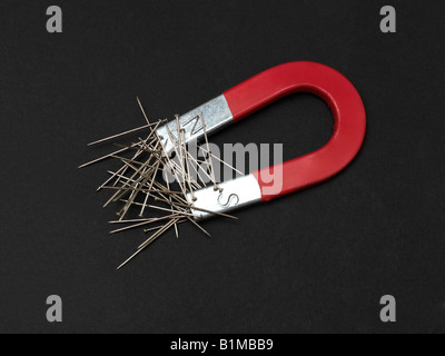 Horse shoe Magnet Picking up Pins Stock Photo - Alamy
