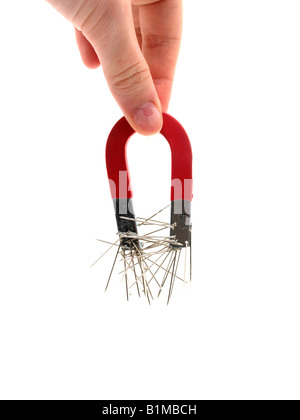 Horse shoe Magnet Picking up Pins Stock Photo - Alamy