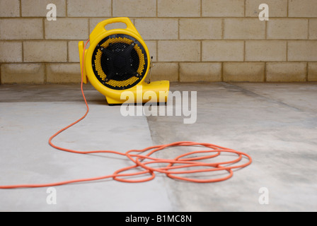 Air blower fan drying a flood damaged room Stock Photo - Alamy