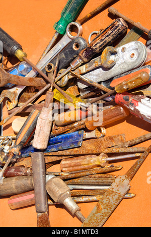 Old rusty tools lying on a wooden work bench Stock Photo - Alamy