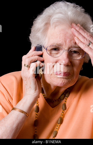 worried woman when making a call using a cell phone Stock Photo - Alamy