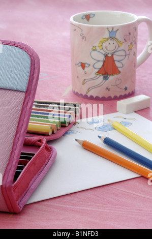 Cups with school stationery, pencil case and backpack on table against ...