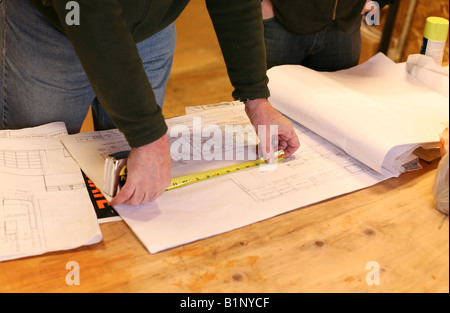 Measure, blueprint and architecture hands drawing lines for project development construction ...