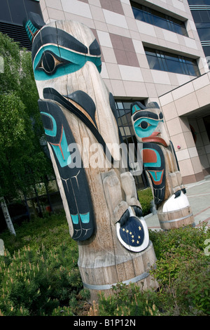 Totem poles in from of Anchorage courthouse, Alaska, USA Stock Photo ...