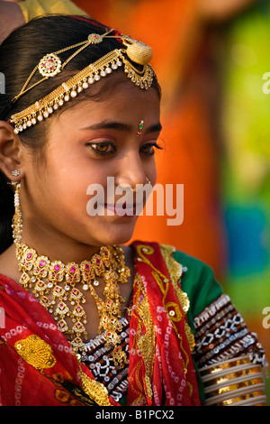 A Rajasthani girl dressed in her finest clothing and jewelry to ...