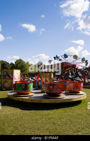 Spinning teacups - a fairground ride Stock Photo - Alamy