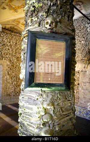 Column decorated with human bones with human skulls on the sides ...