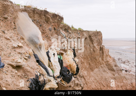 old landfill rubbish revealed in sea cliffs by coastal erosion on ...