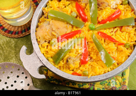 Typical Cuban food, chicken, rice with black beans, fried banana chips ...