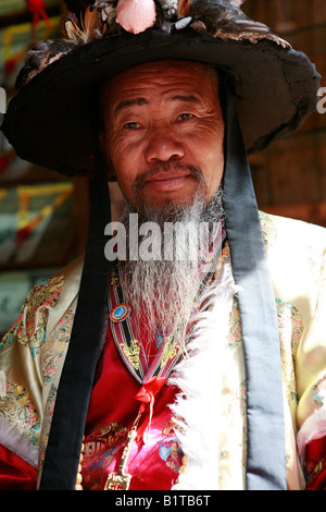 Naxi shaman Dongba in traditional dress and pipe, Lijang, ancient ...