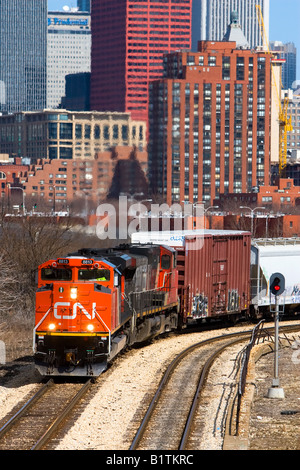 A Canadian National freight train with the Chicago skyline in the ...