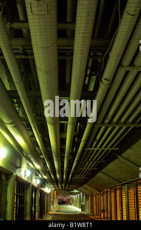 Pipes on ceiling in corridor Stock Photo - Alamy