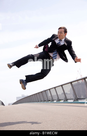 Japanese office worker jumping lively Stock Photo - Alamy