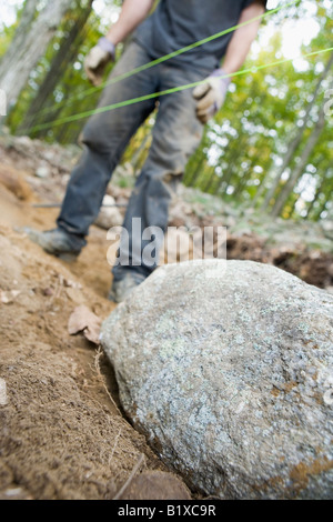 Man building stone fence Stock Photo - Alamy