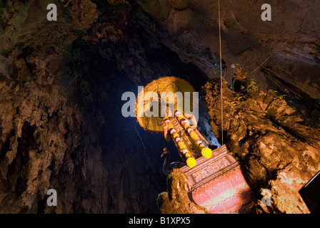 Decorated Hindu statue of Lord Murugan on top of a kadavi carried by a ...