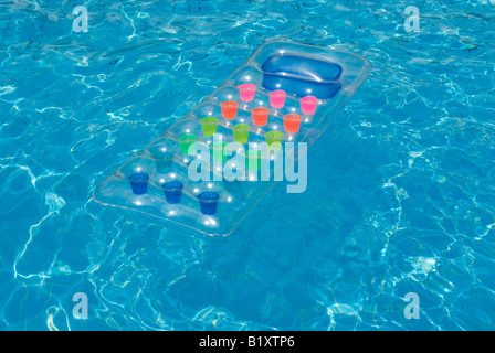Rubber Lilo floating in a swimming pool Stock Photo - Alamy