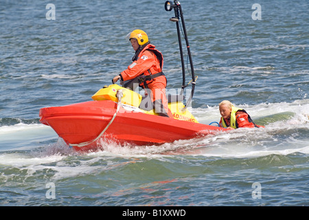 Sea rescue boatman saves distressed person and gets him her out of ...
