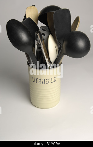 Kitchen utensils stacked in a display can Stock Photo - Alamy