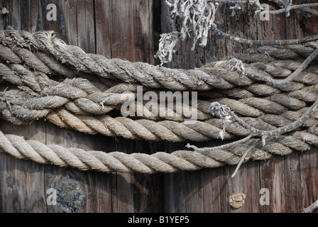 Pillar wrapped with Rope at Harbor Stock Photo - Alamy